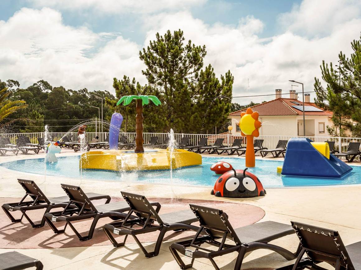 The indoor swimming pool and water park at the Colina do Sol campsite ...